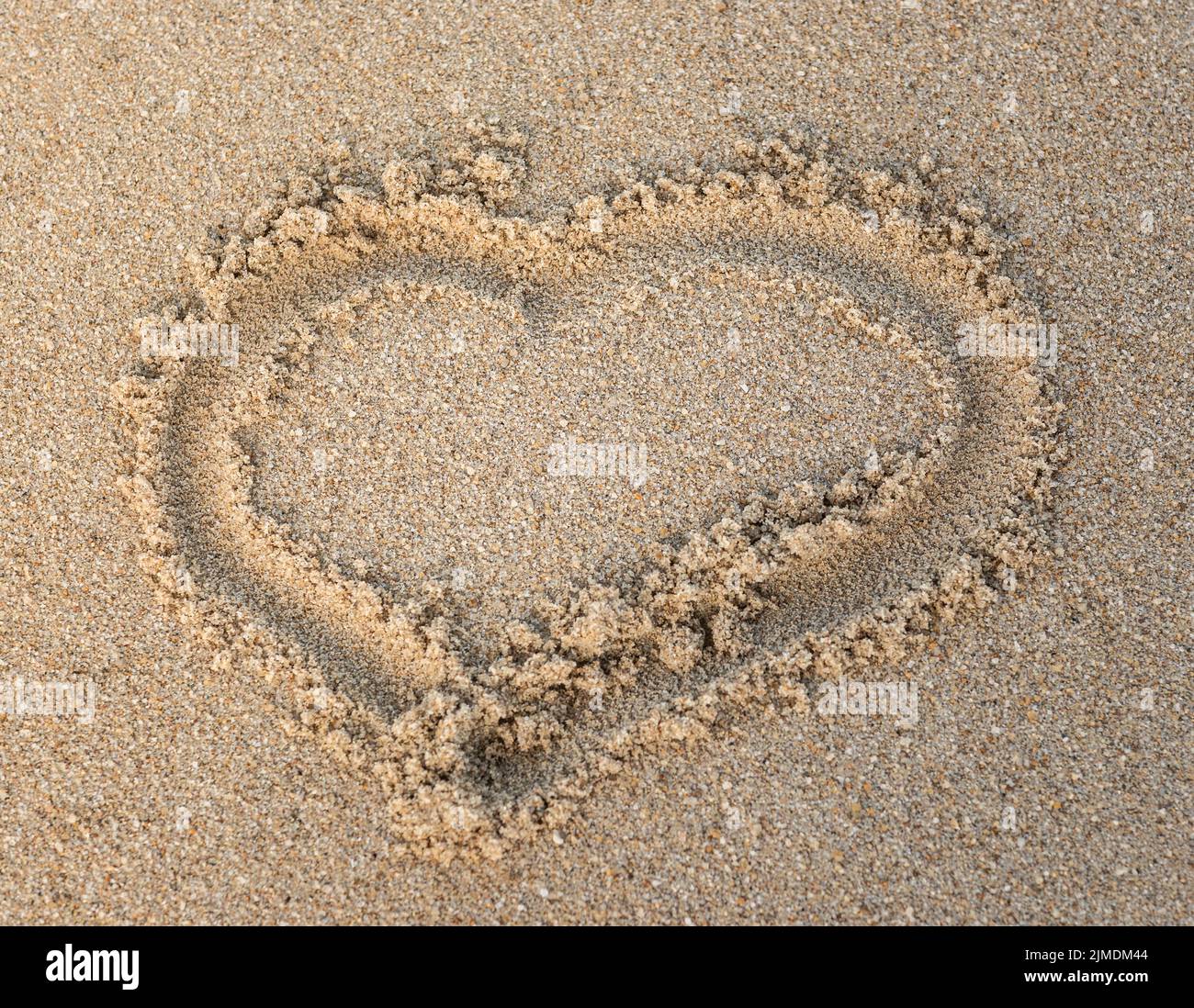 Heart shape on the sand Stock Photo - Alamy