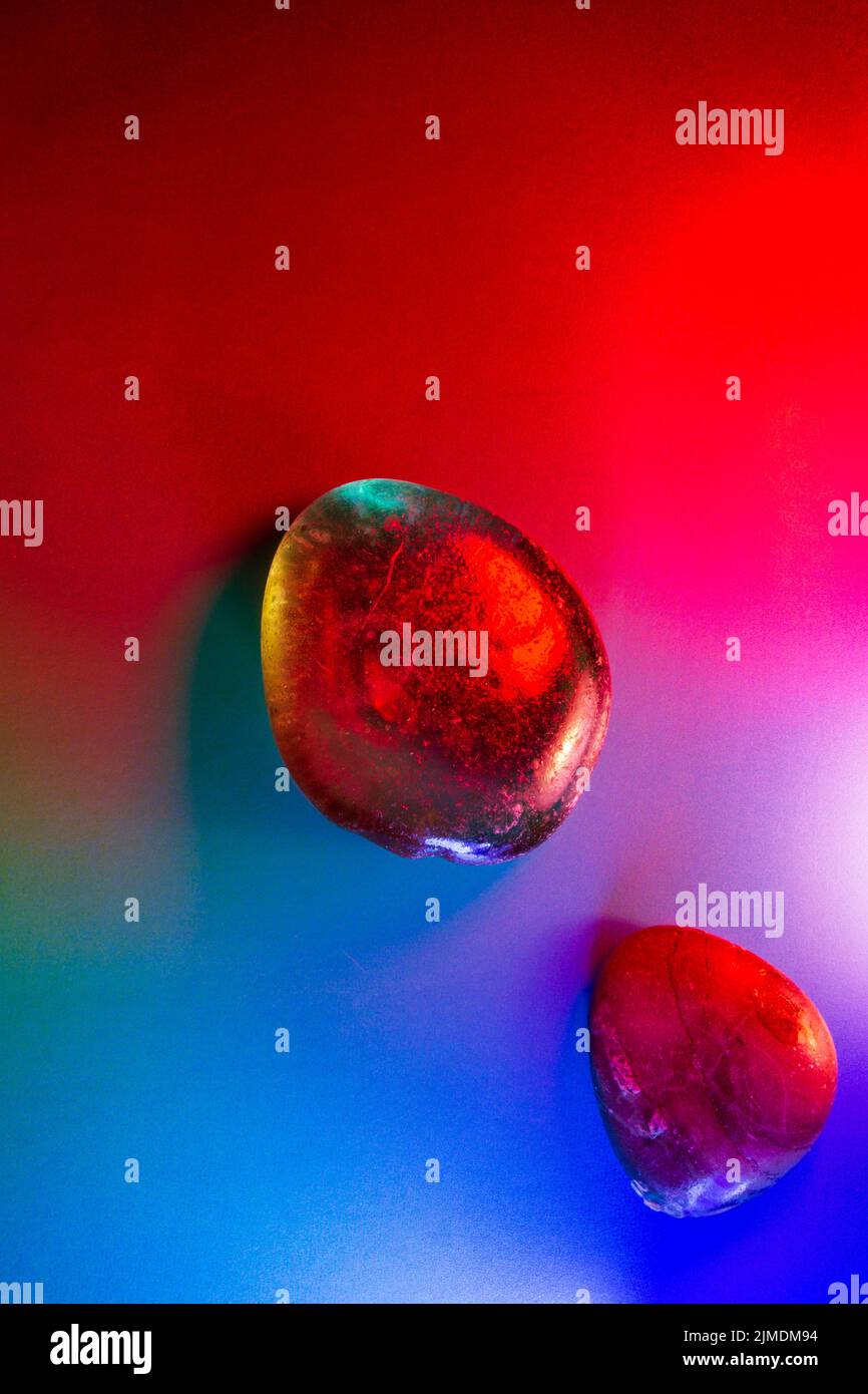 Two mineral gems colorfully illuminated showing abstract details Stock ...