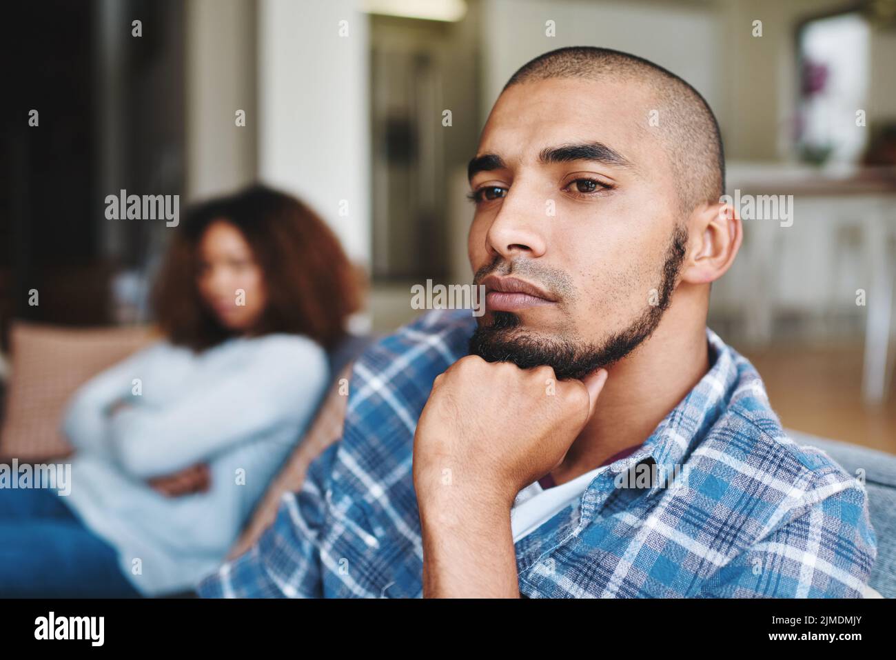 Unhappy couple after argument with a frustrated, upset and sad husband ...