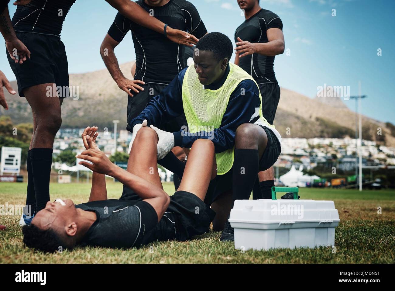 This looks like a bad injury. a young rugby player receiving first aid ...
