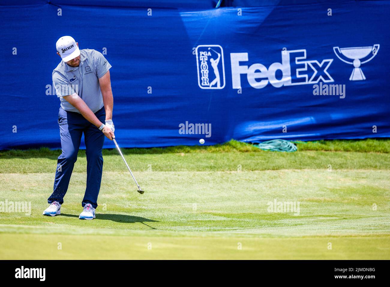 August 5, 2022: Matthew NeSmith chips onto the eighteenth green during ...