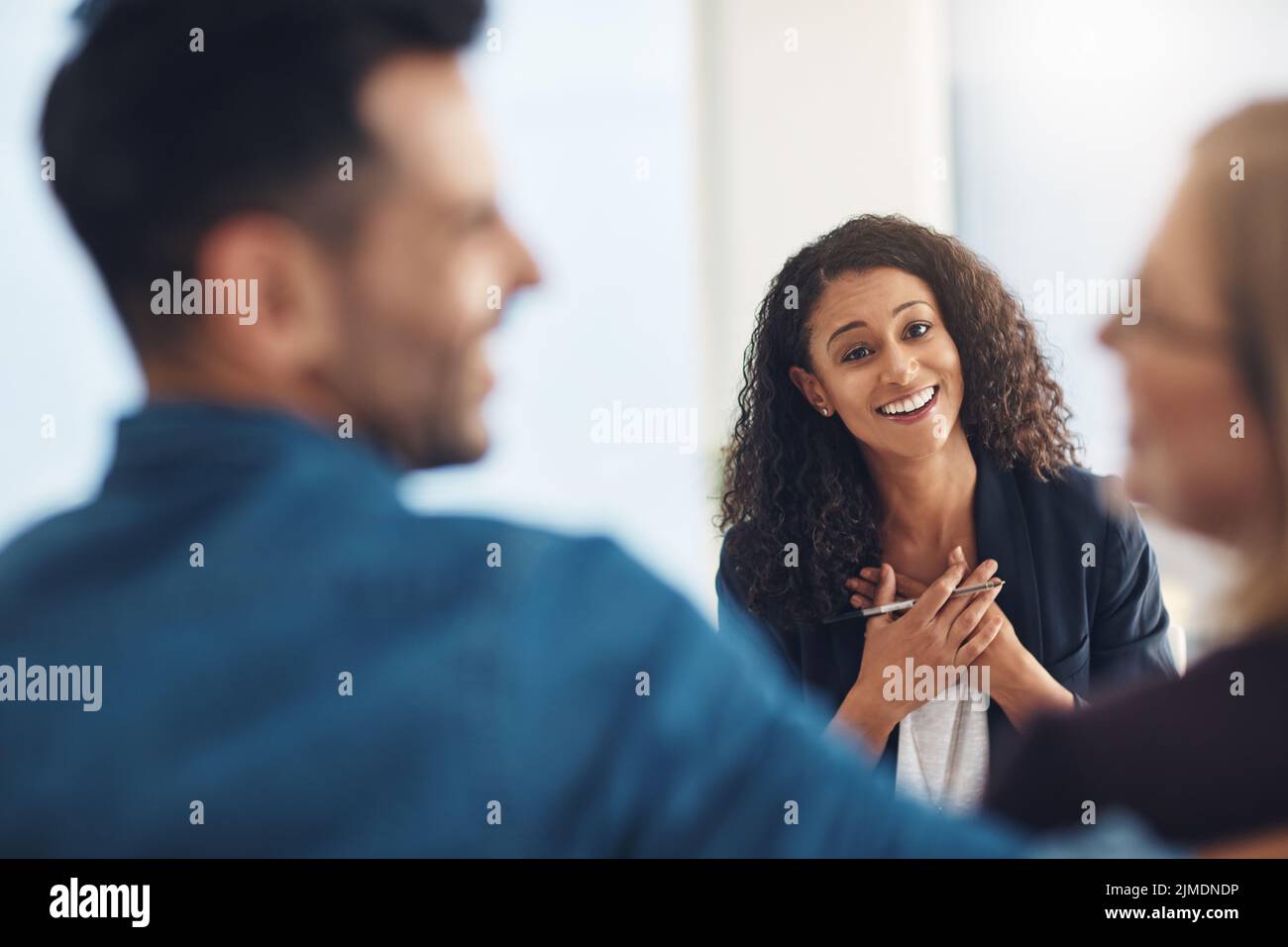 Smiling psychologist looking happy, cheerful and successful after ...