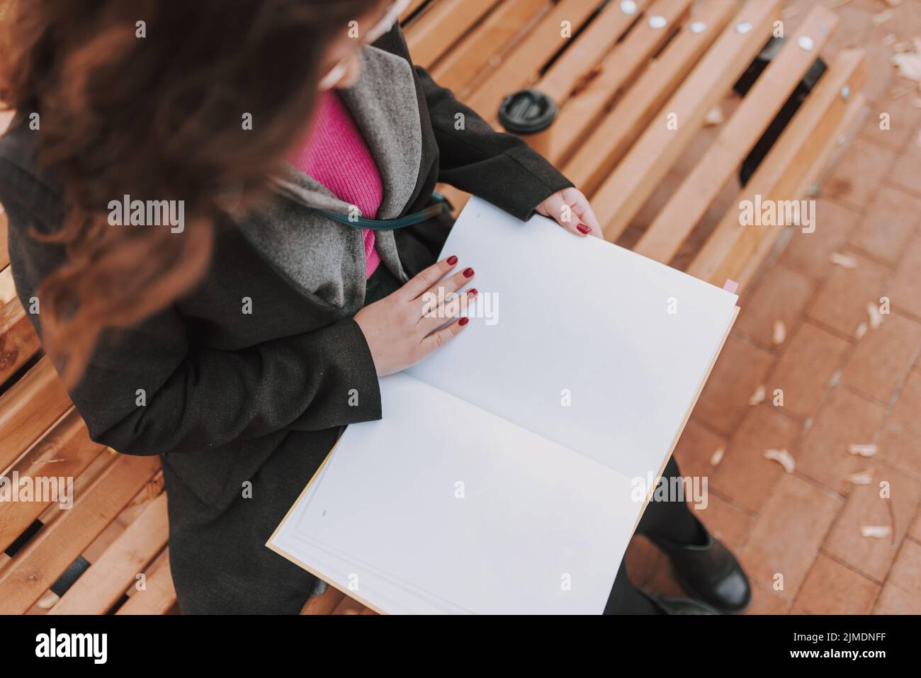 Young student reading book outdoors hi-res stock photography and images ...