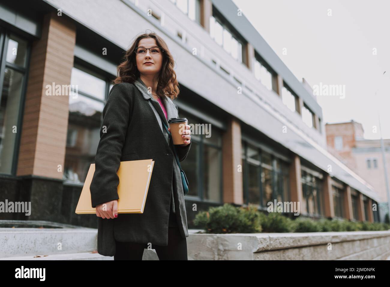 Confident young specialist ready for work in office building Stock ...