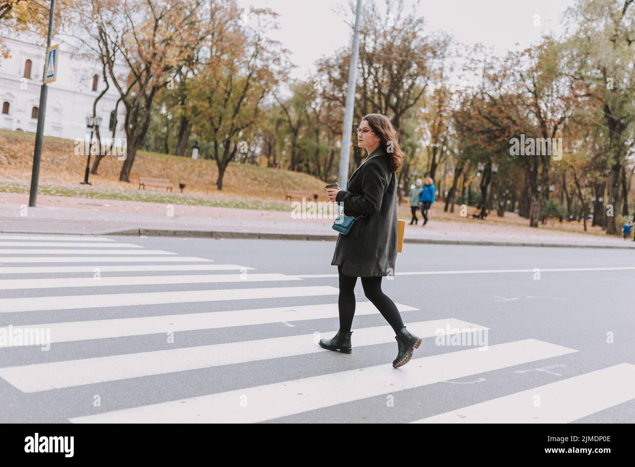 Female pedestrian crossing hi-res stock photography and images - Alamy
