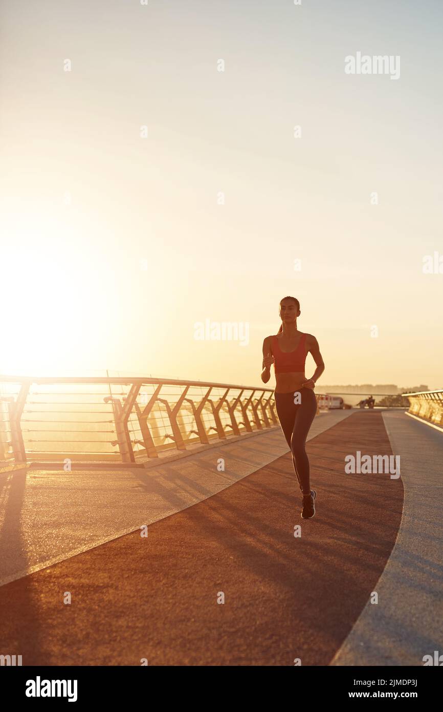 Girl doing sport outdoors in the morning Stock Photo - Alamy