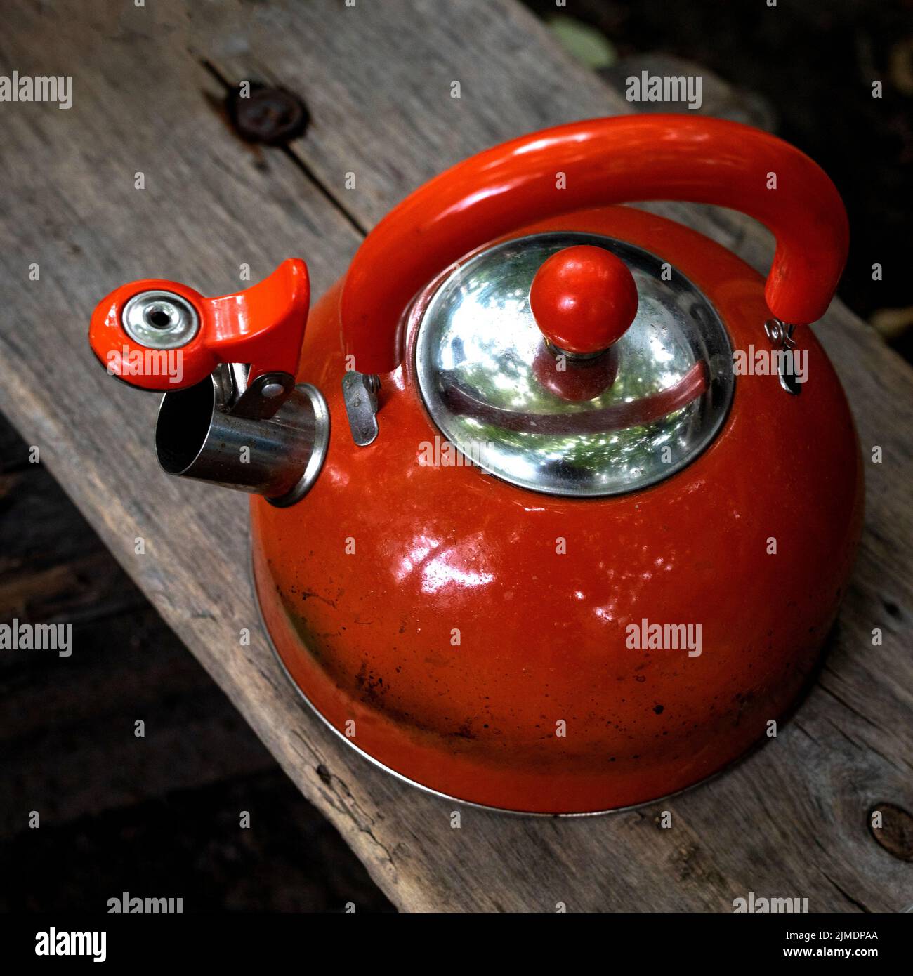 Travel vintage tea kettle with whistle red color Stock Photo - Alamy
