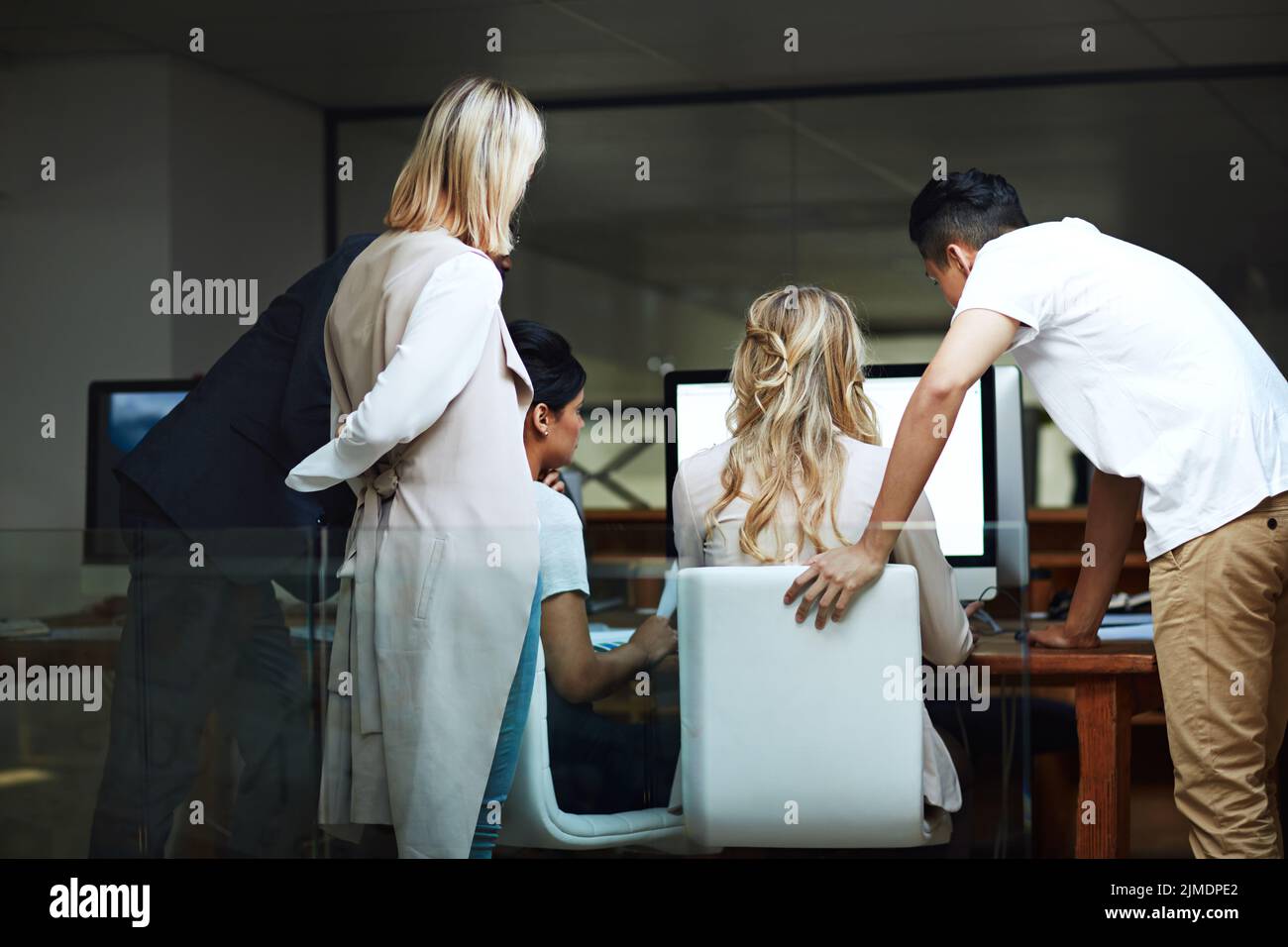 Team of colleagues planning, discussing and sharing ideas while working ...