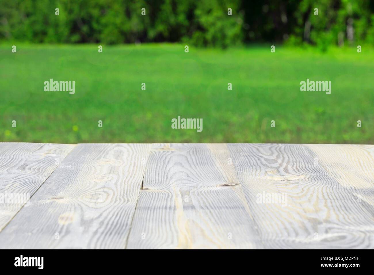 Nature blur background, wood table outdoor in garden park in spring ...