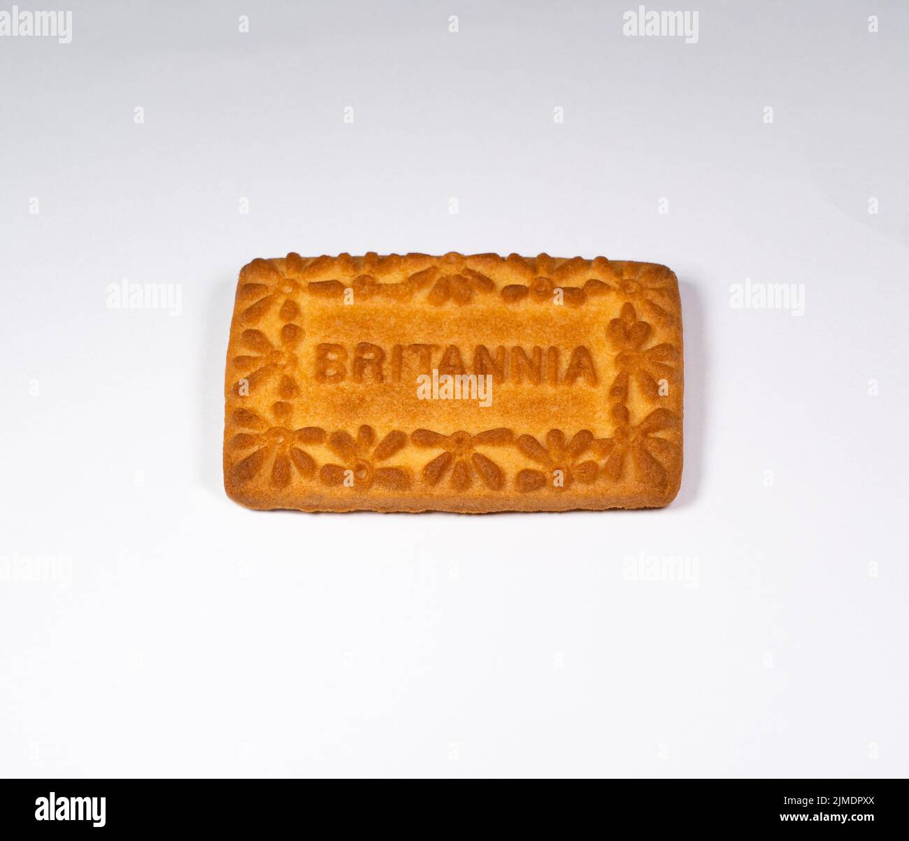 A single Britannia Milk Bikis biscuit on a white background Stock Photo ...