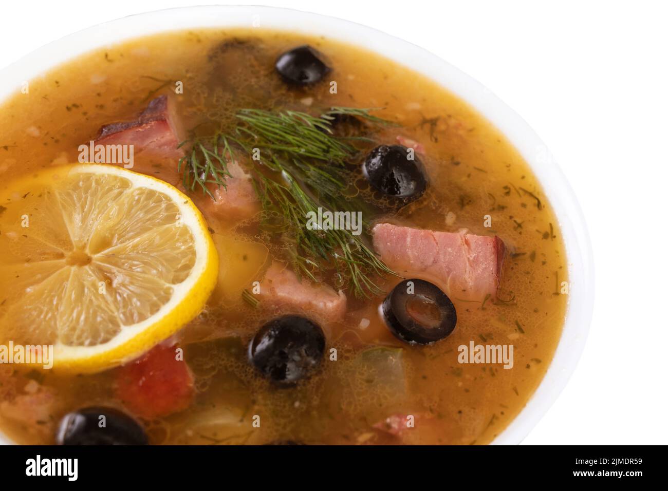 Soup with meat, olives, lemon, seasonings and spices. Russian Solyanka ...