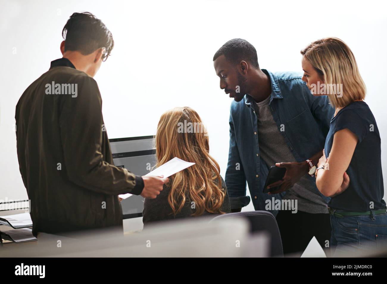 Business people working together on computer desktop while planning ...