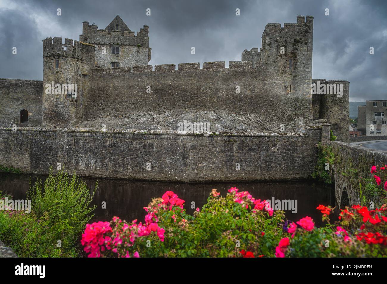 Cahir castle with moat in Cahir town with dramatic, storm sky in ...