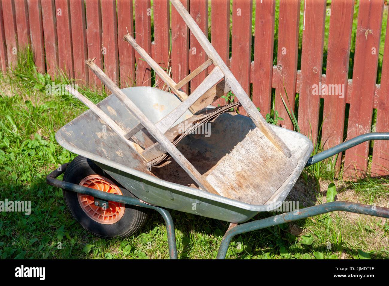 moving old wooden chair on a trolley to be thrown away Stock Photo - Alamy