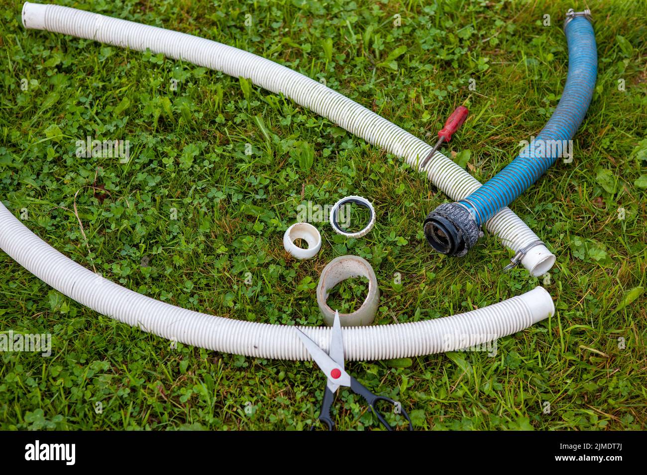 disconnected water hoses ready to get fixed to prevent leak, outdoor ...