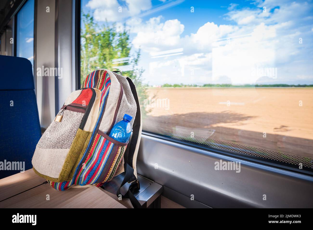 Backpack on the train near the window. Travel conceptual image Stock ...