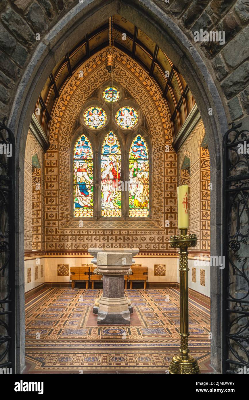 Interior, aspersorium or stoup and stained glass in St. Marys Cathedral ...