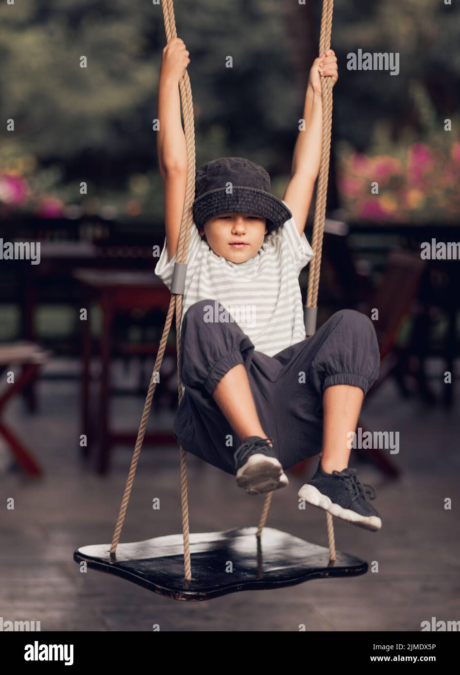 Portrait boy on swing hi-res stock photography and images - Alamy