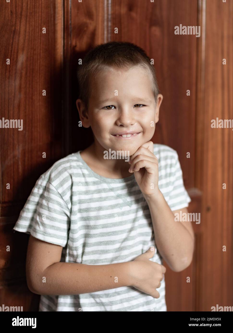 Indoor portrait of a cute boy Stock Photo - Alamy