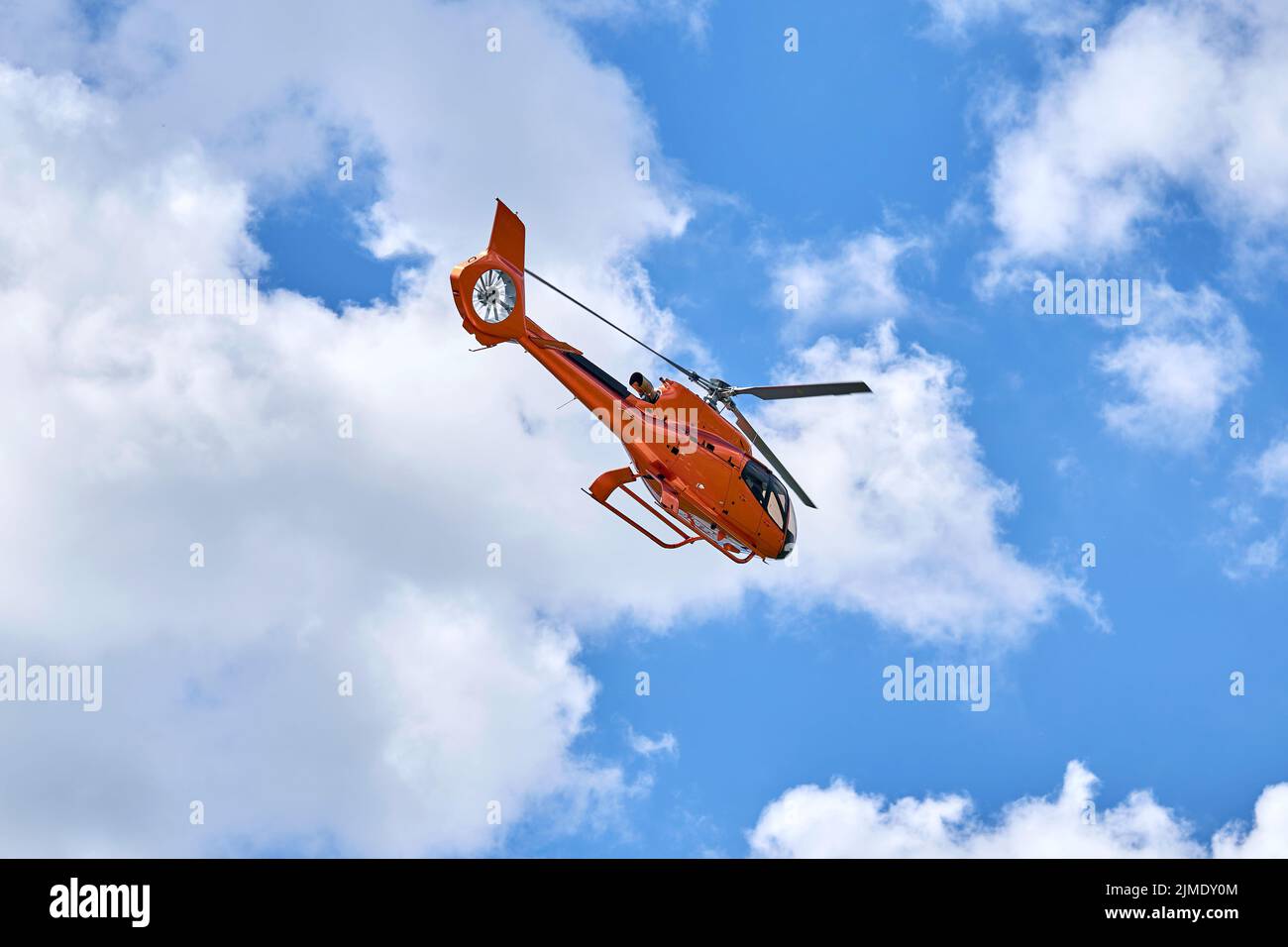 private helicopter flying in the sky Stock Photo - Alamy