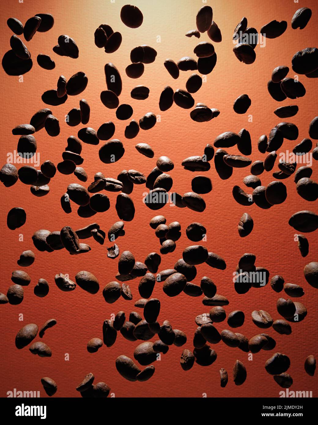 Coffee beans falling from above Stock Photo - Alamy