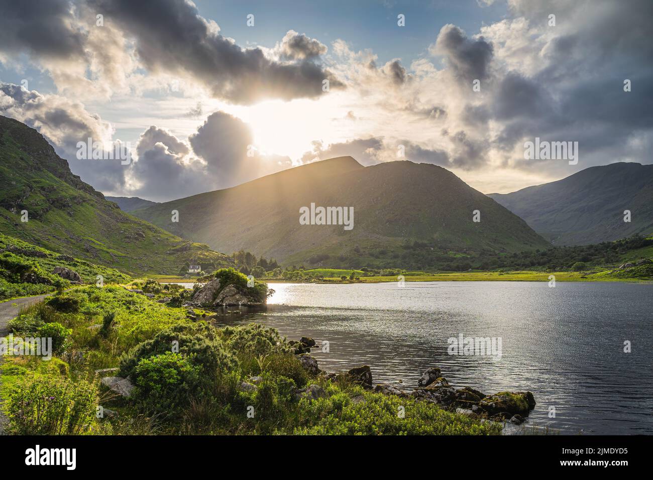 Gummeenduff lake and rocky hills of MacGillycuddys Reeks mountains ...