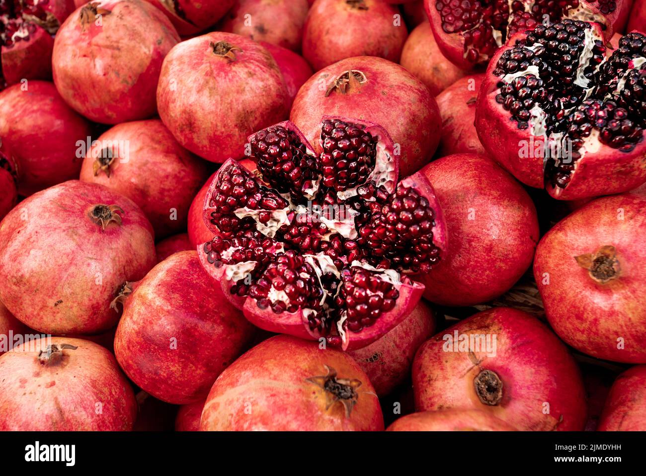 Cracked pomegranate. Ripe Pomegranates Background Stock Photo - Alamy