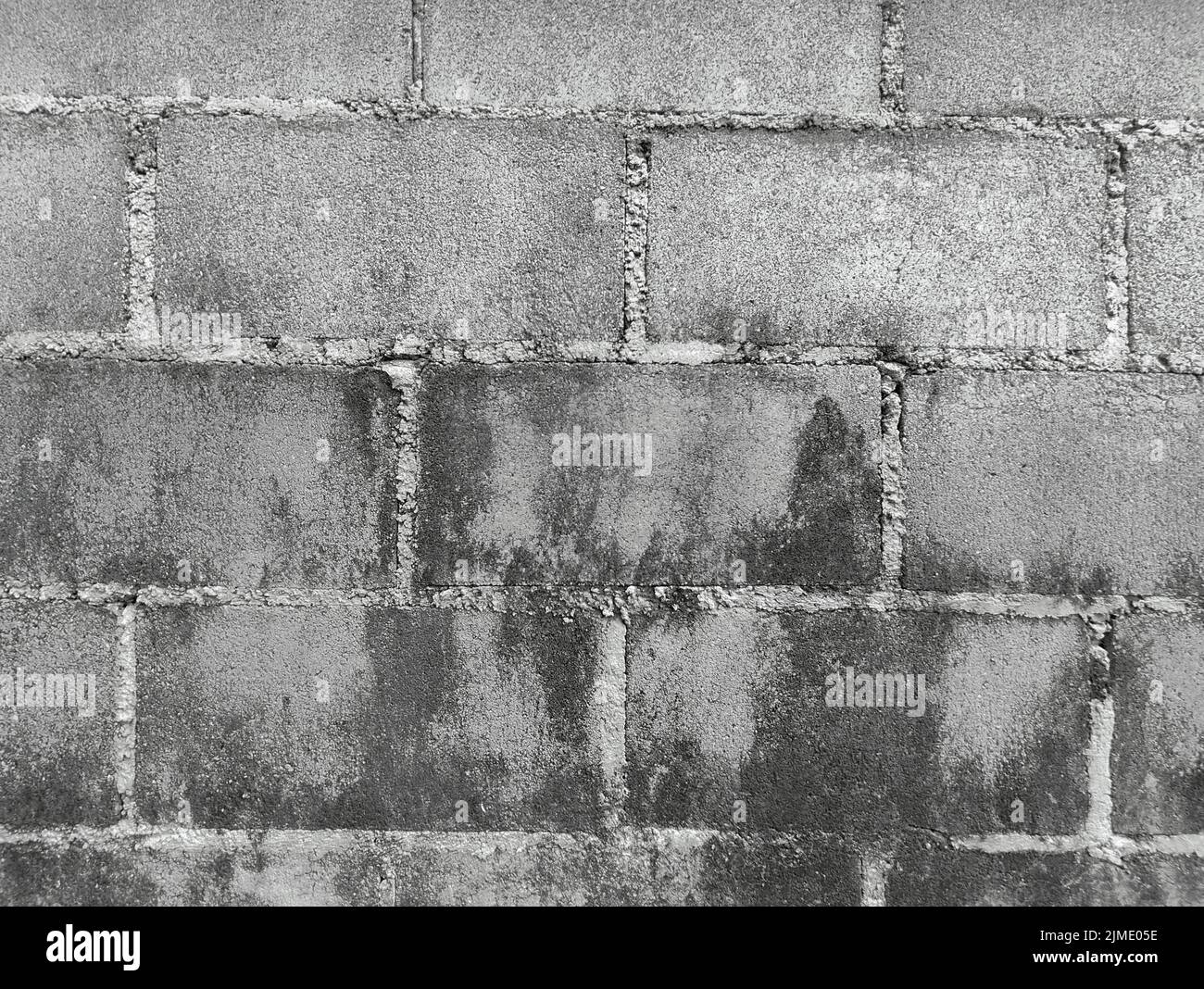 Close-up of White cement crack block wall and peeled paint caused by ...