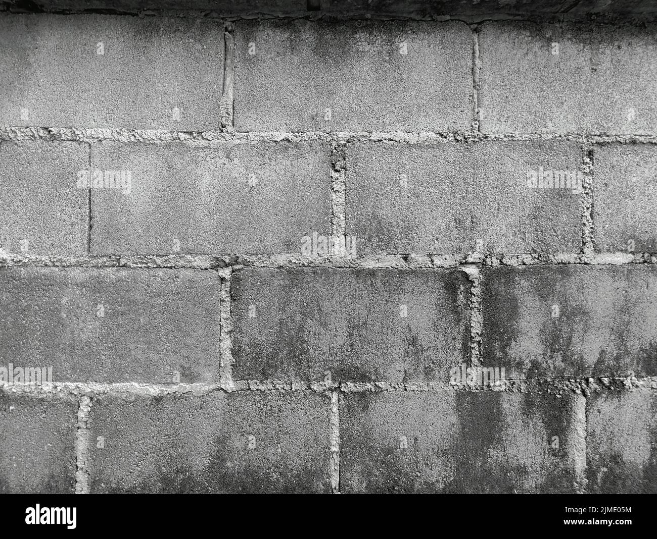 Close-up of White cement crack block wall and peeled paint caused by ...