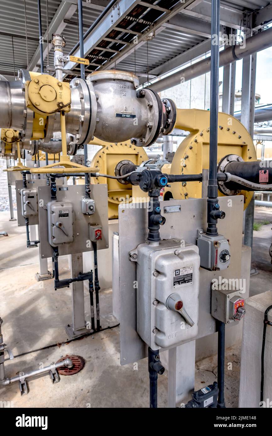 Pipes, tubes, machinery and steam turbine at a power plant Stock Photo ...