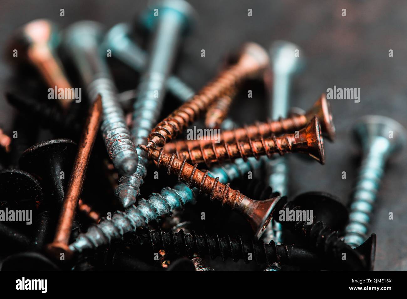 Different Kind of Screws on a table in a workshop Stock Photo - Alamy