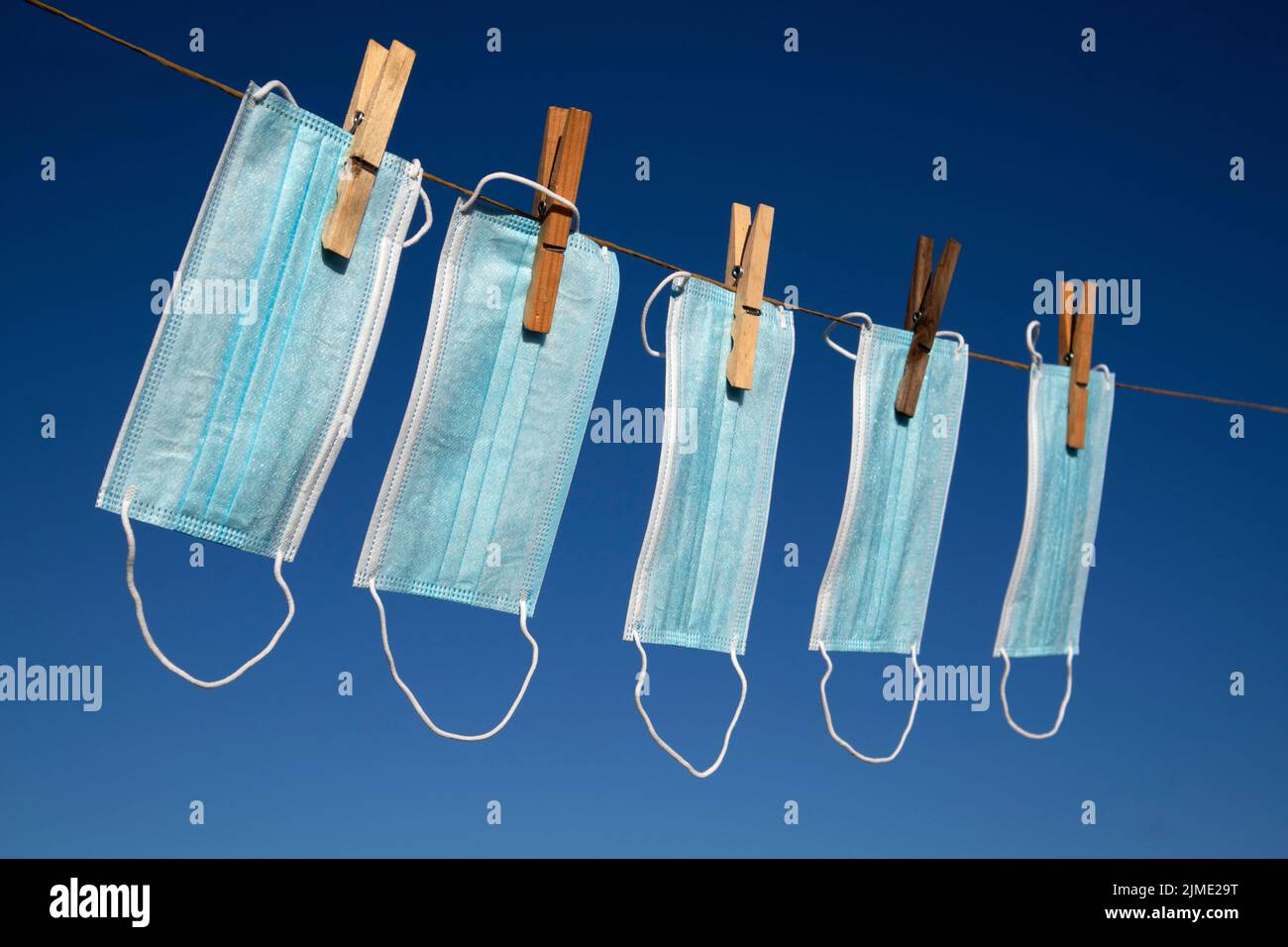 Wash and dry the anti Covid-19 masks Stock Photo - Alamy