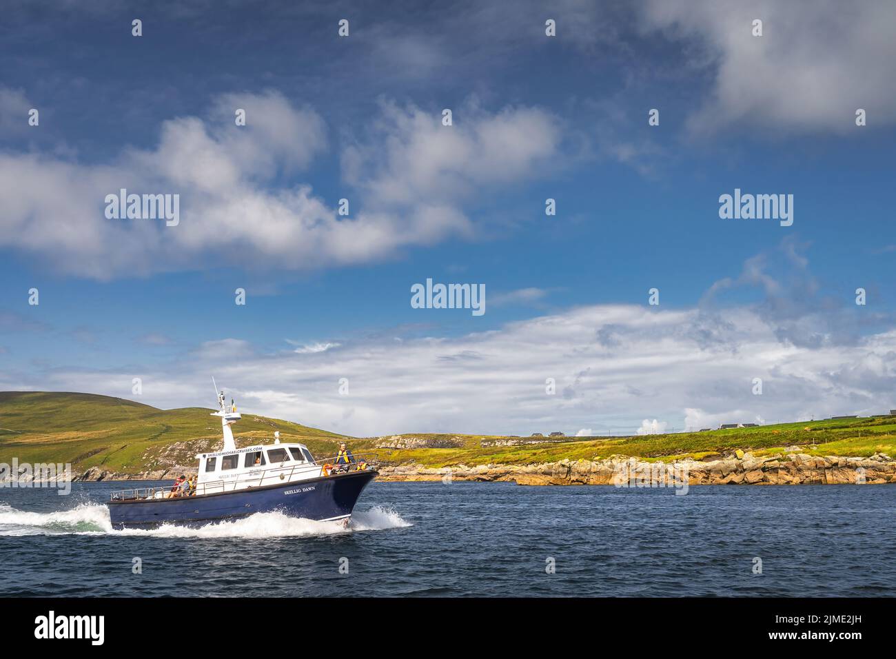 Group of tourists sailing on a boat to visit Skellig Michael island ...