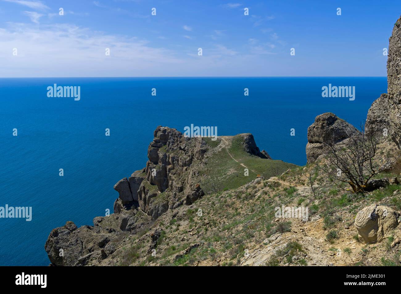 Steep rocky cliff above the sea Stock Photo - Alamy