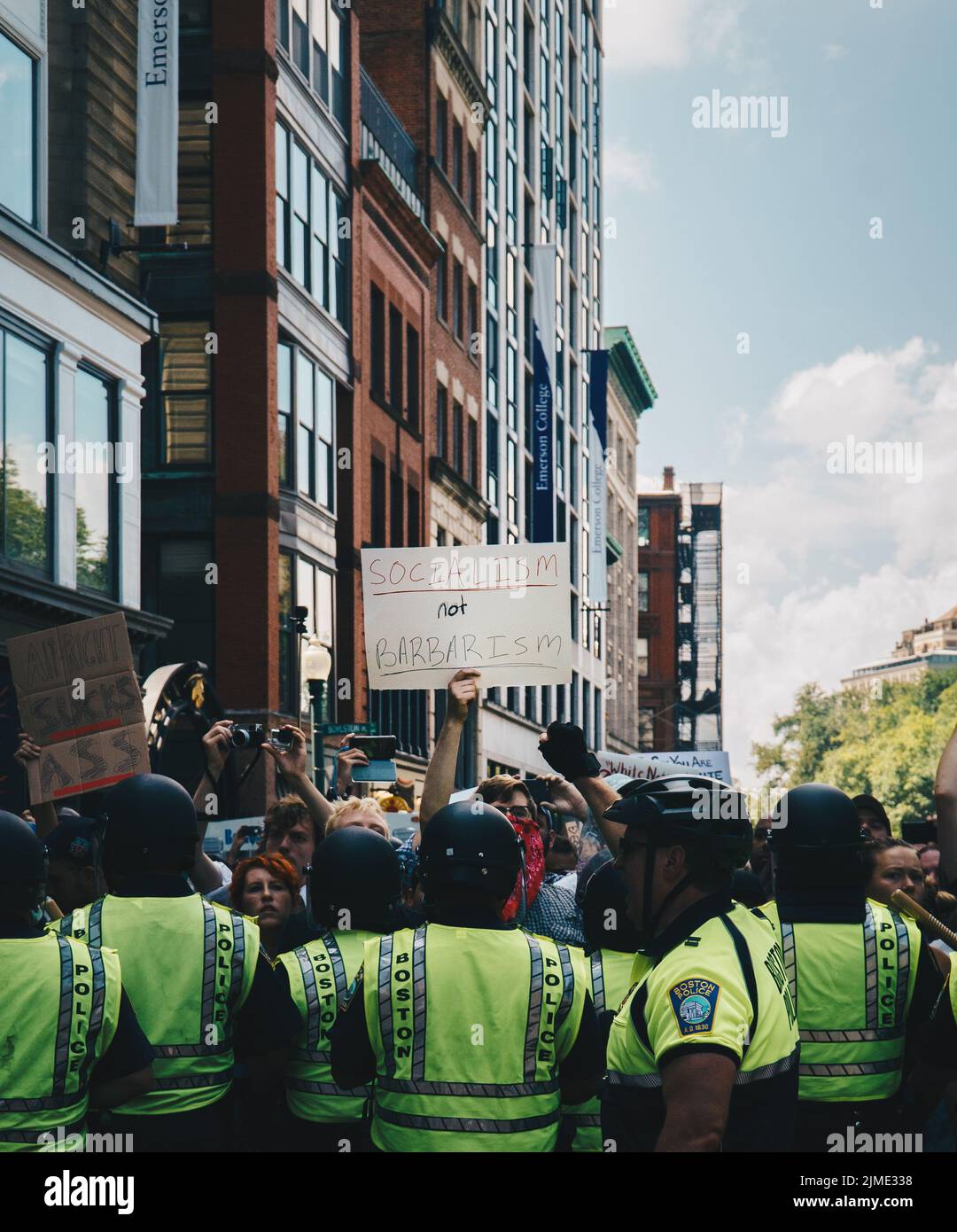 The vertical view of Boston Police hold off a crowd during a protest ...