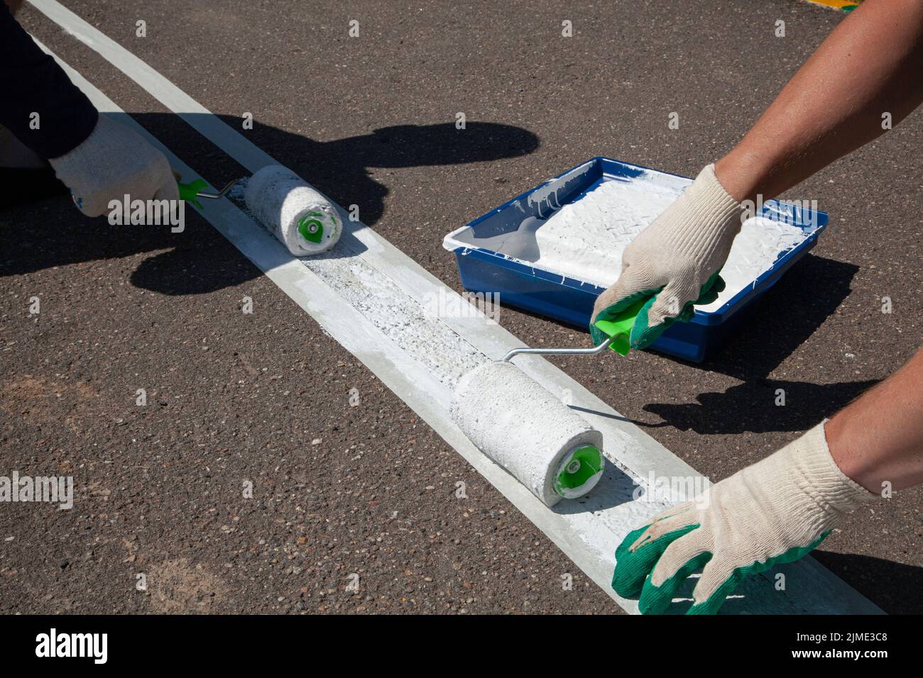 Drawing markup on the asphalt Stock Photo - Alamy