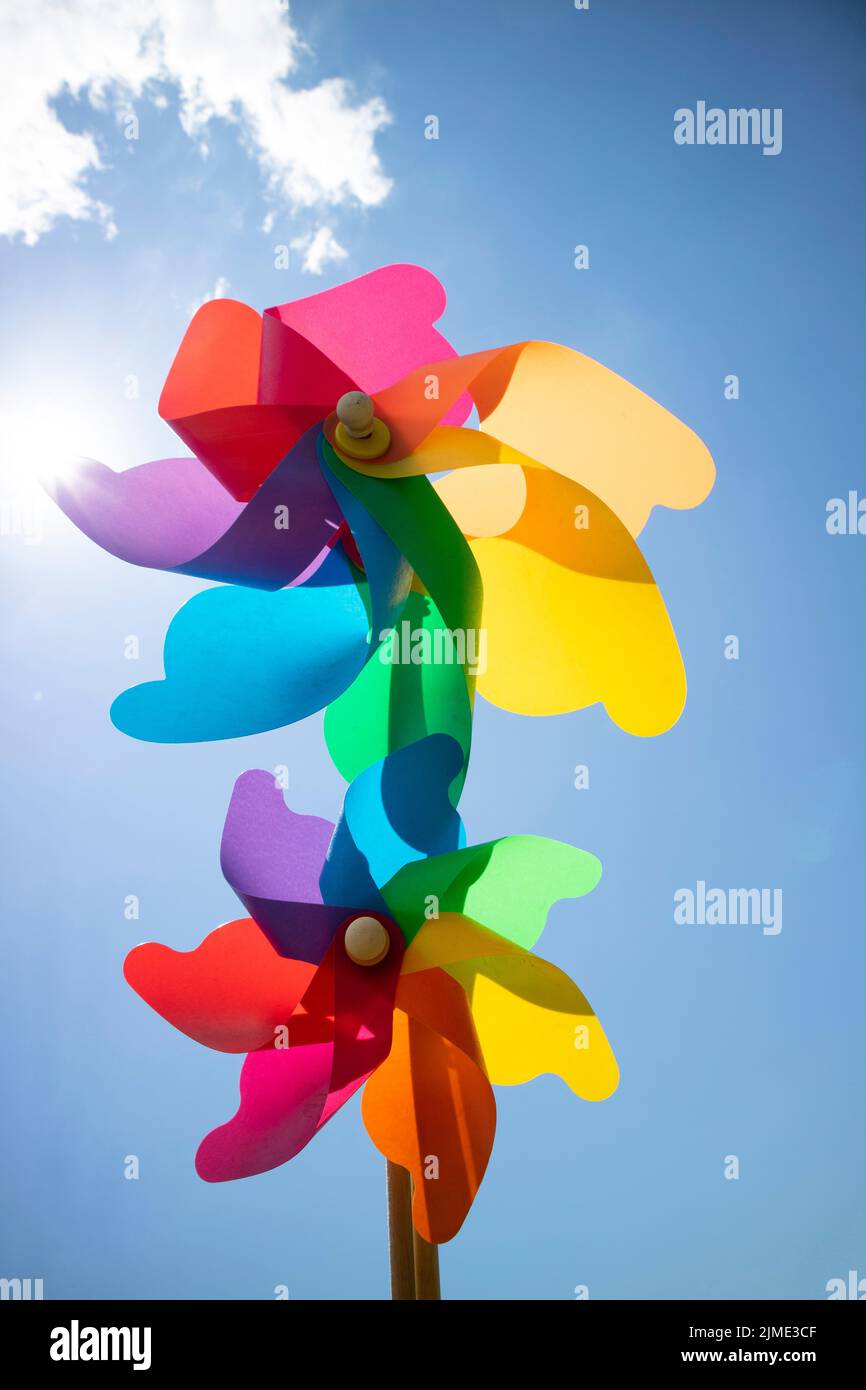 Multicolored pinwheels in the blue sky Stock Photo - Alamy