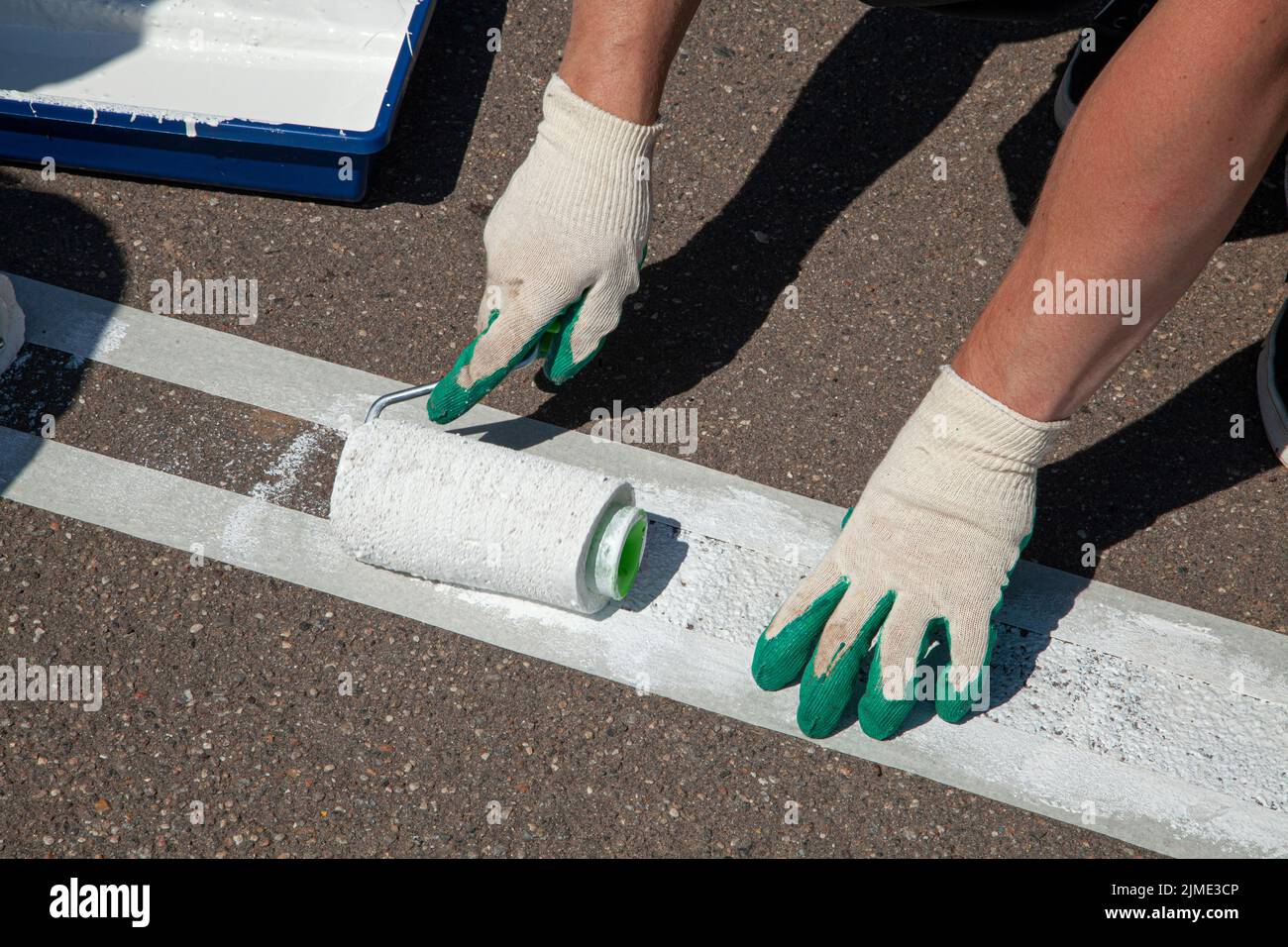 Drawing markup on the asphalt Stock Photo - Alamy