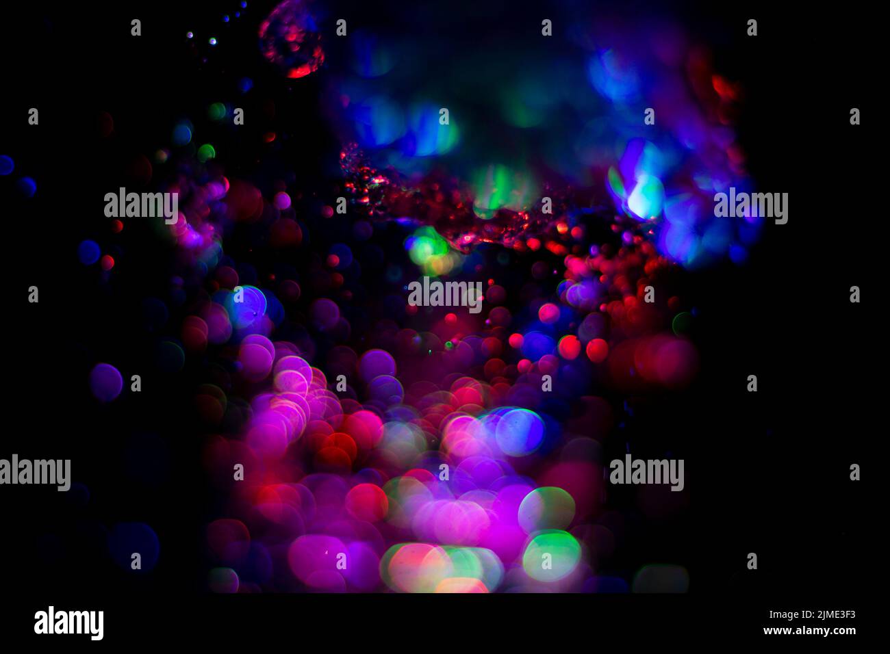 Colored water texture. Splashes of water lit in different colors Stock ...