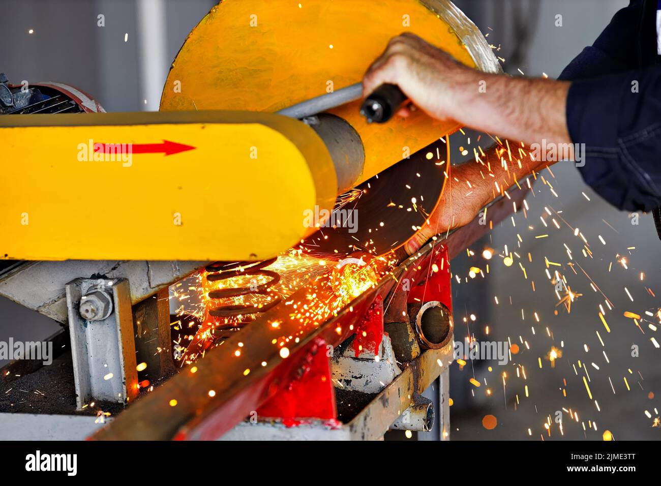 Metal sawing in the workshop at the production site with a stationary ...