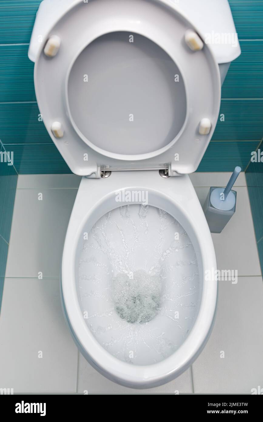 Cleaning white toilet water hi-res stock photography and images - Alamy