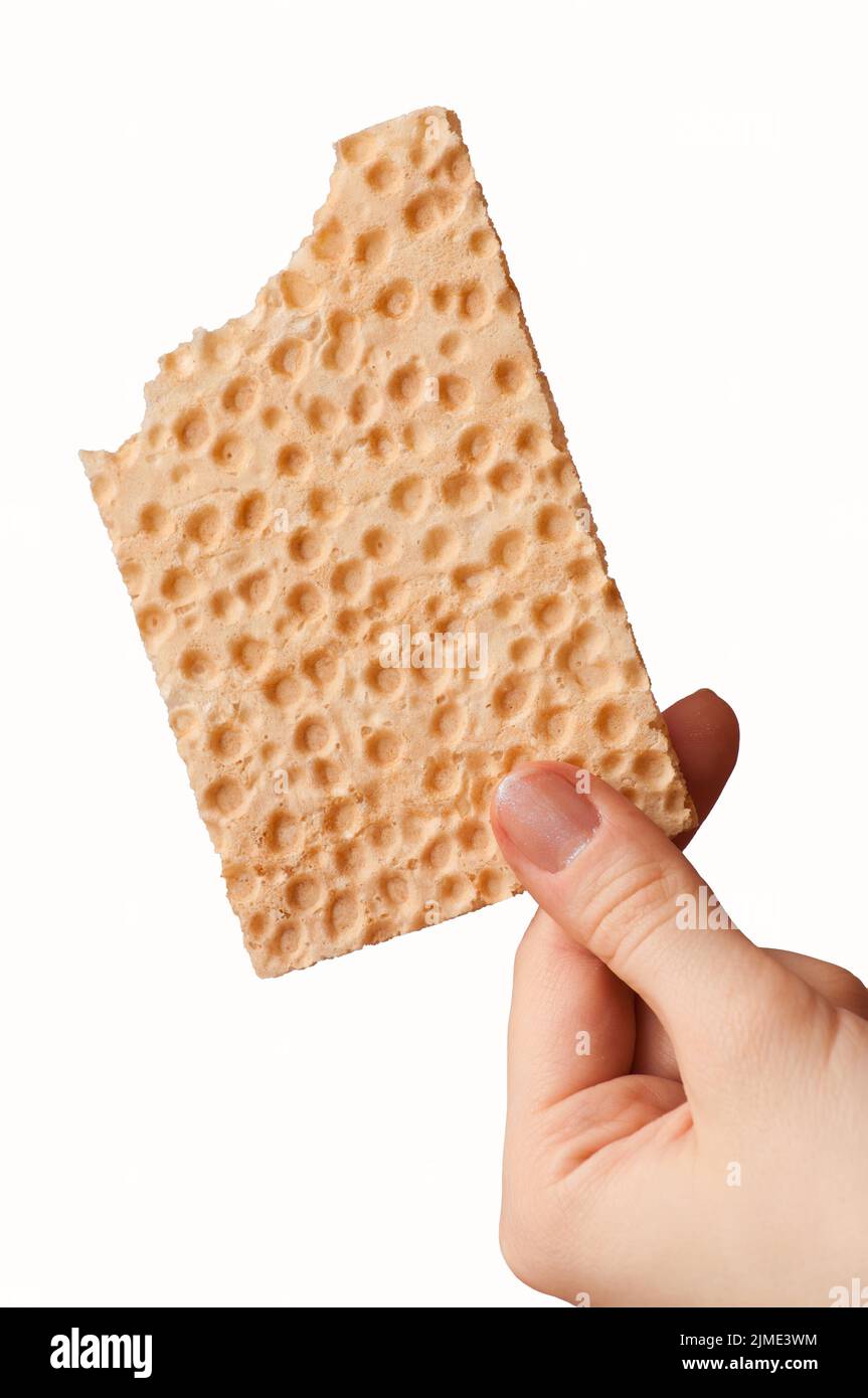 Bitten bread crisps in a hand Stock Photo - Alamy