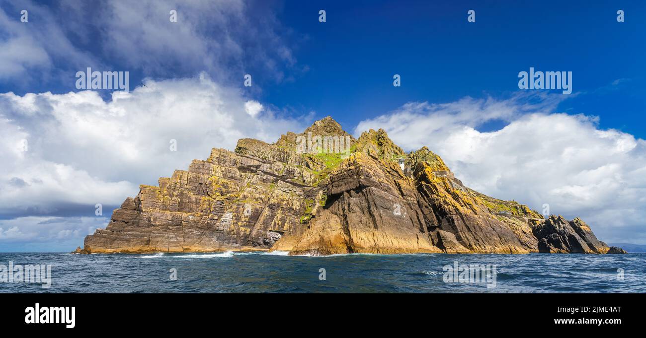 Skellig Lighthouse sticks out from behind off the rock on Skellig ...