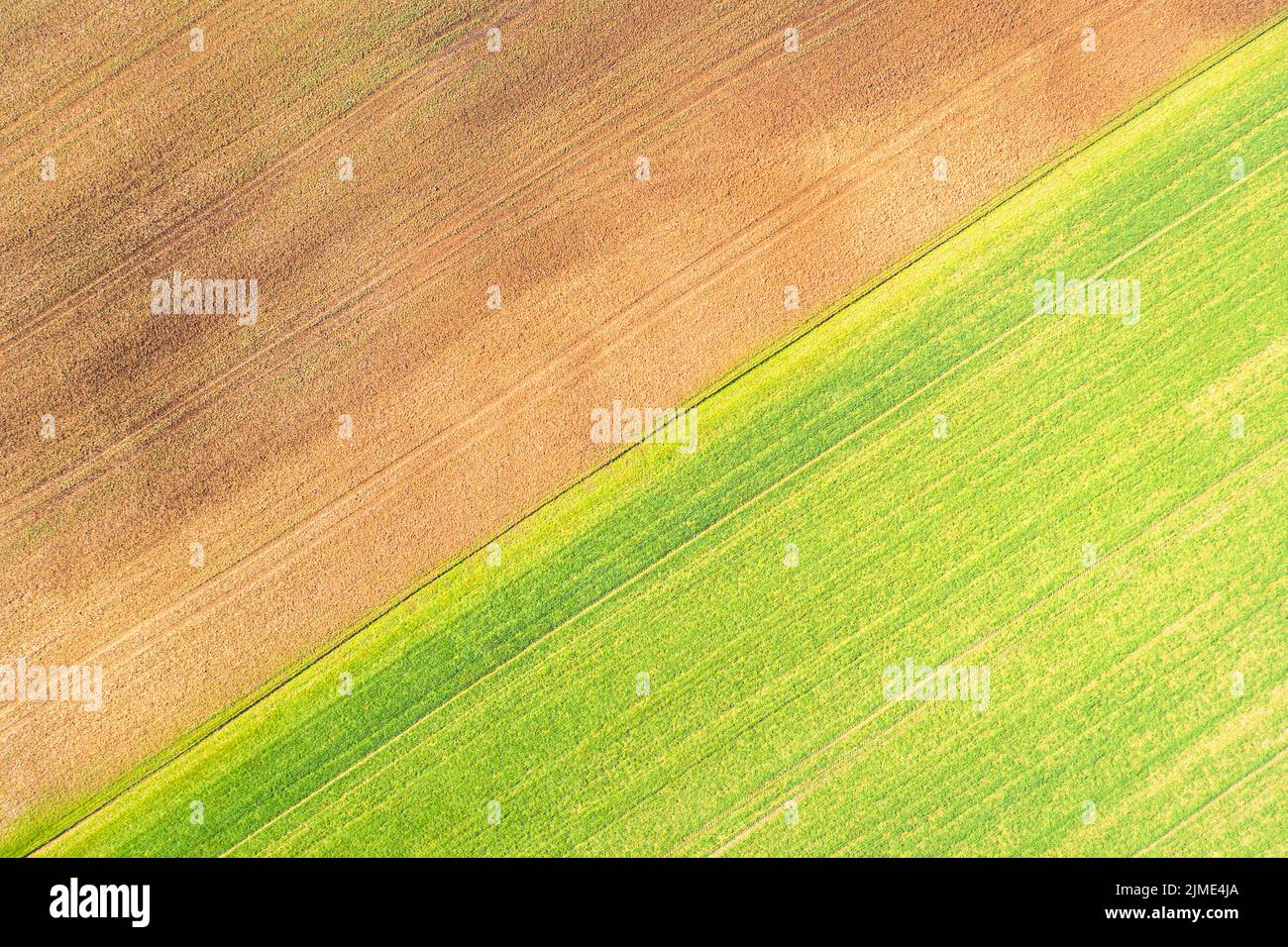 Two fields farming landscape from above Stock Photo - Alamy