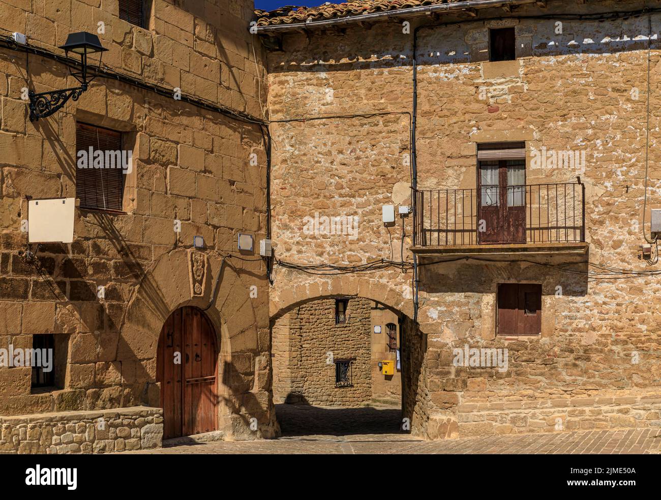 Old stone houses on cobblestone Plaza Mayor in a picturesque medieval ...
