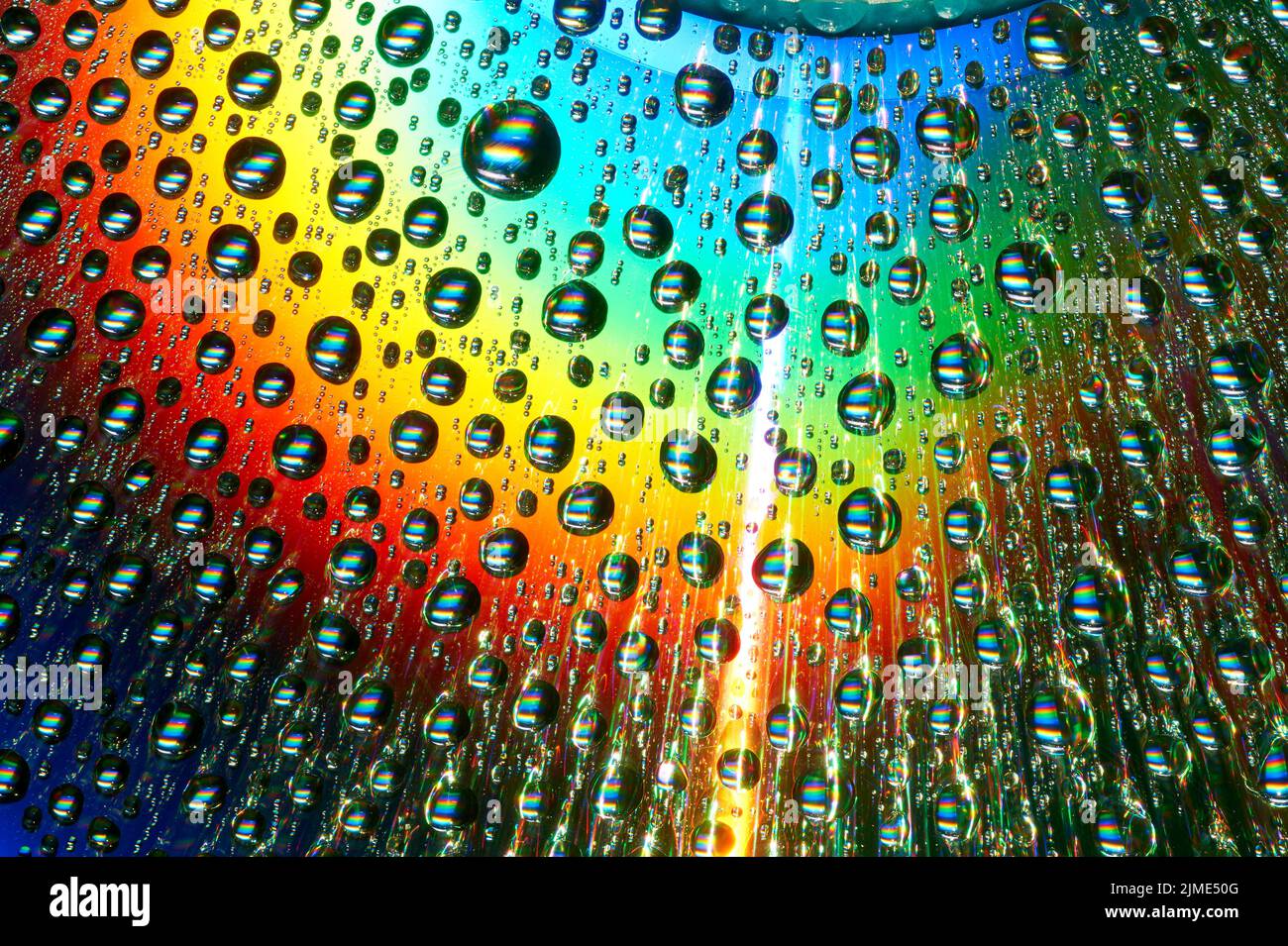 Macro of water drops on multicolor background Stock Photo - Alamy