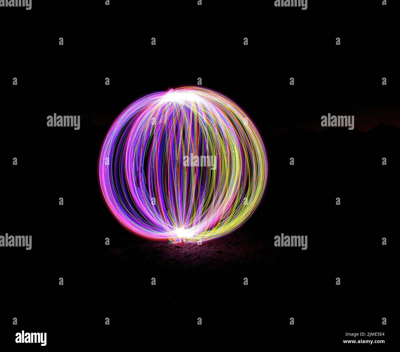 light painting at night with a slow shutter speed on the camera making ...