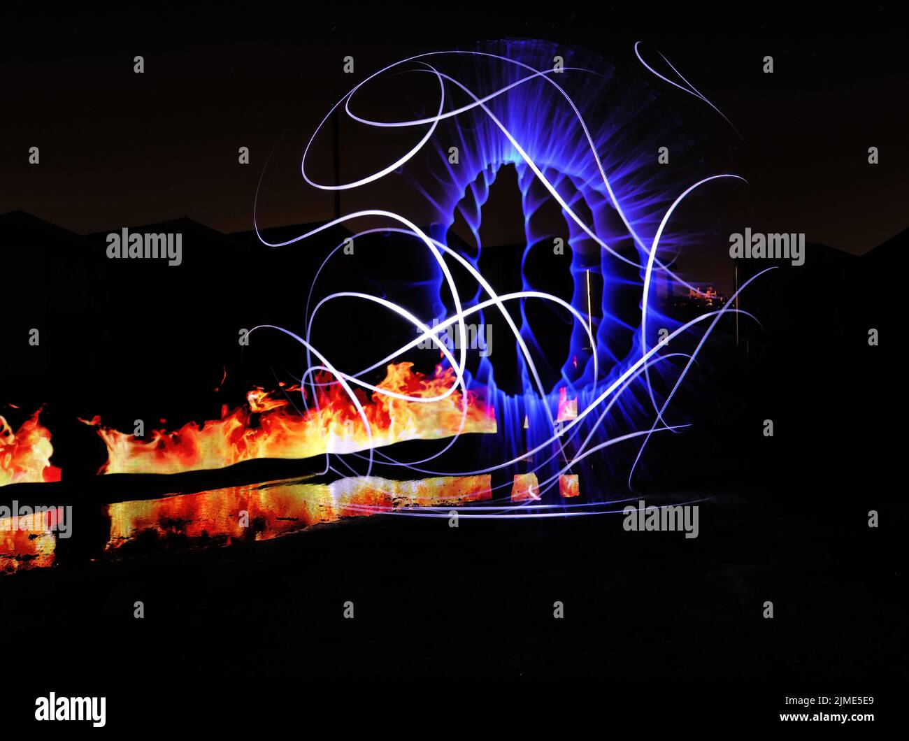 light painting at night with a slow shutter speed on the camera making ...