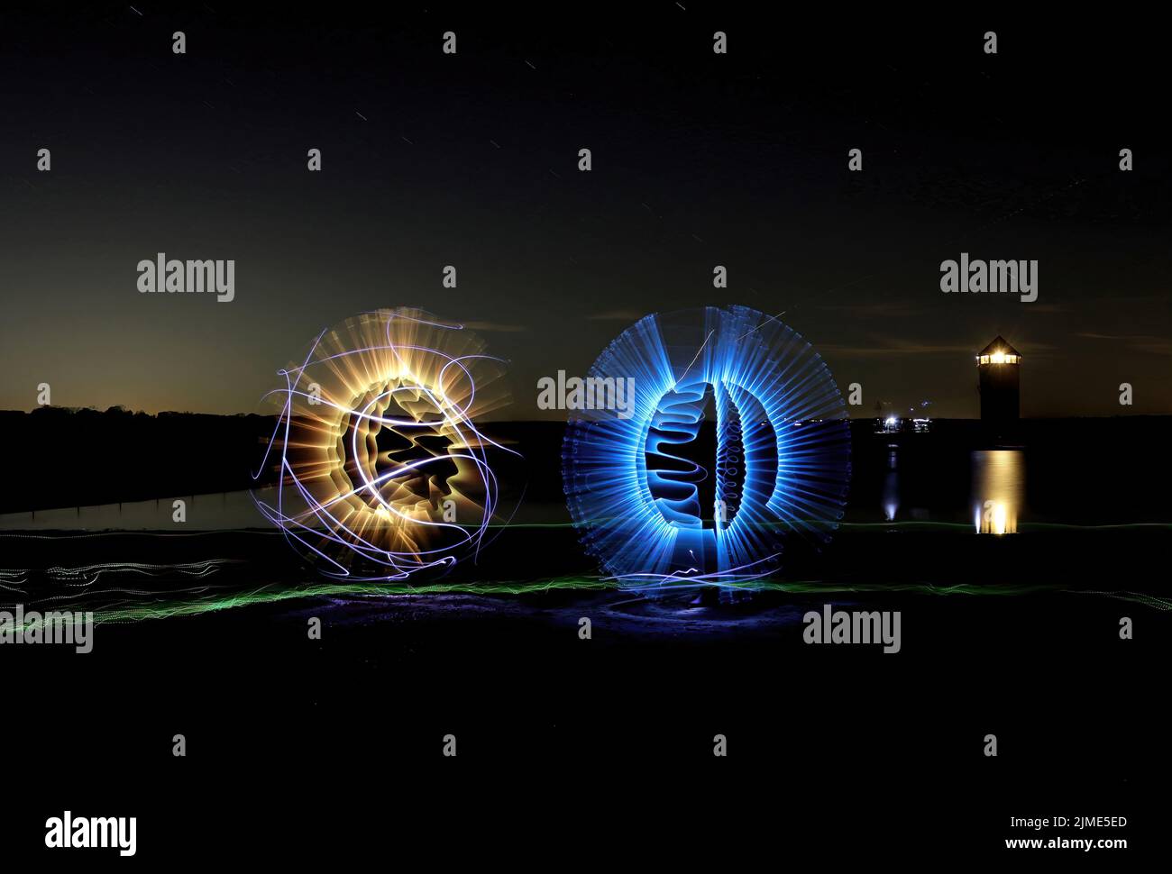 light painting at night with a slow shutter speed on the camera making ...