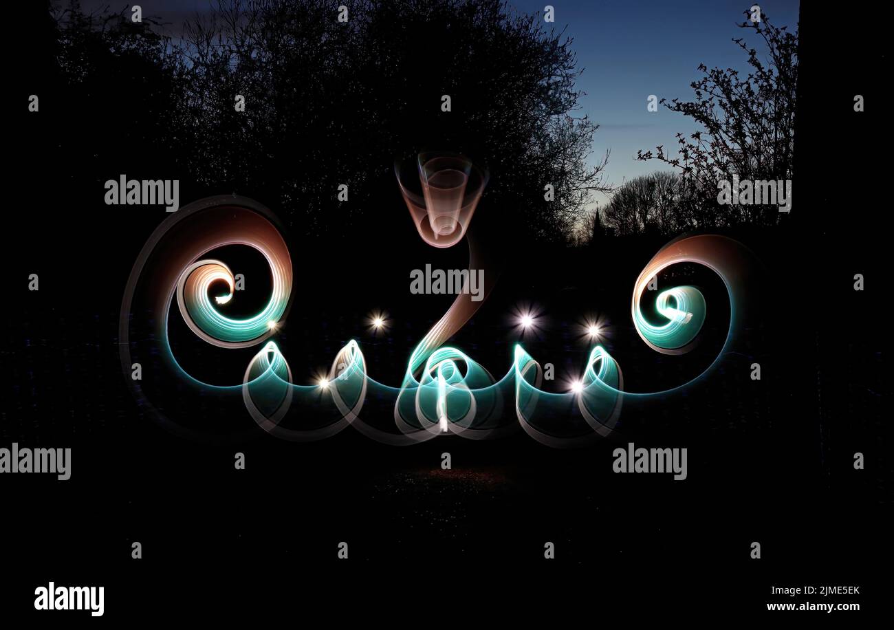 light painting at night with a slow shutter speed on the camera making ...